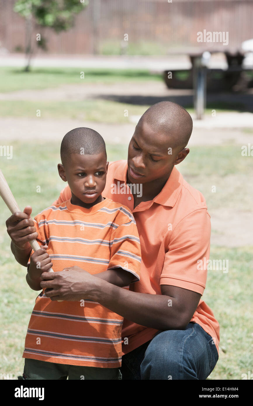 Father teaching son play baseball hi-res stock photography and images ...