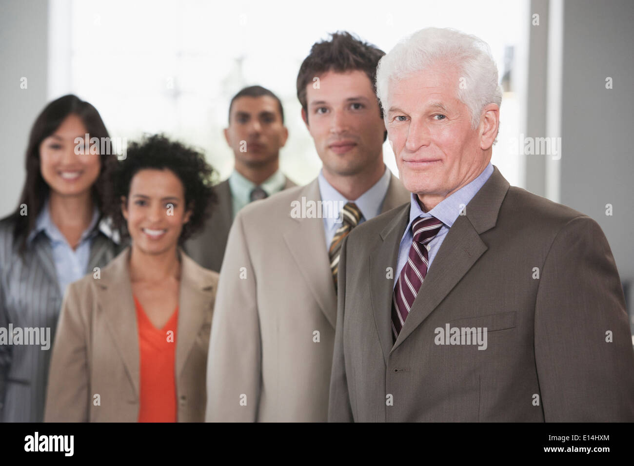 Business people smiling in office Stock Photo - Alamy