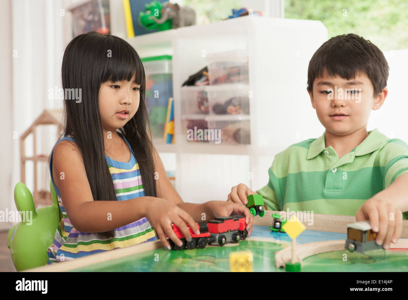 Children playing with train set Stock Photo - Alamy
