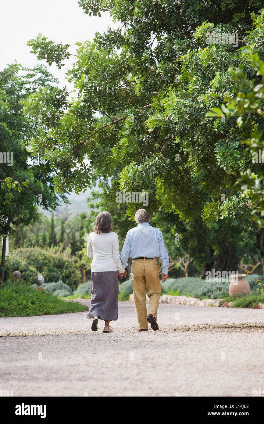 Couple walking together outdoors Stock Photo - Alamy