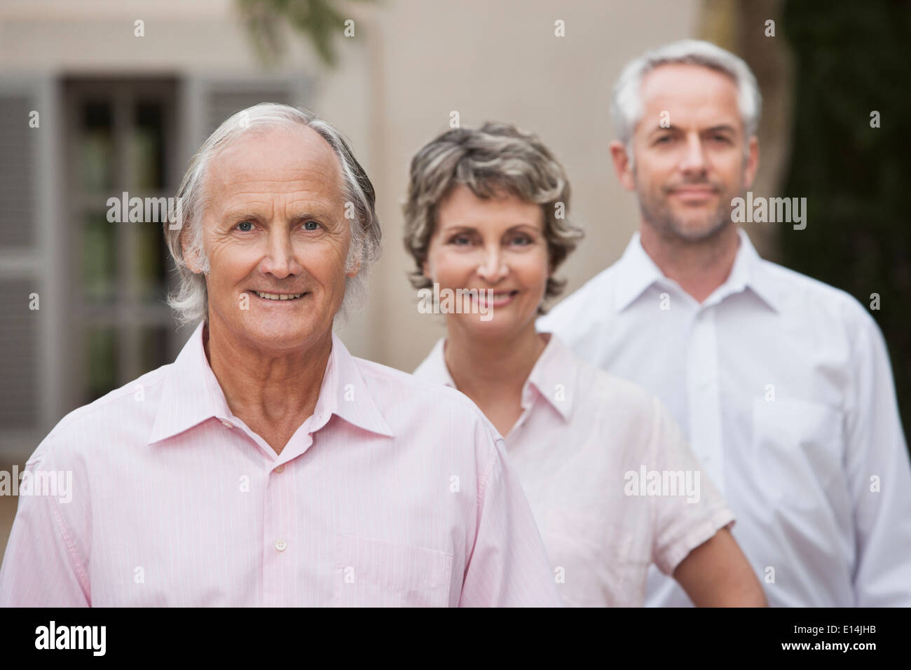 Friends smiling together outdoors Stock Photo - Alamy