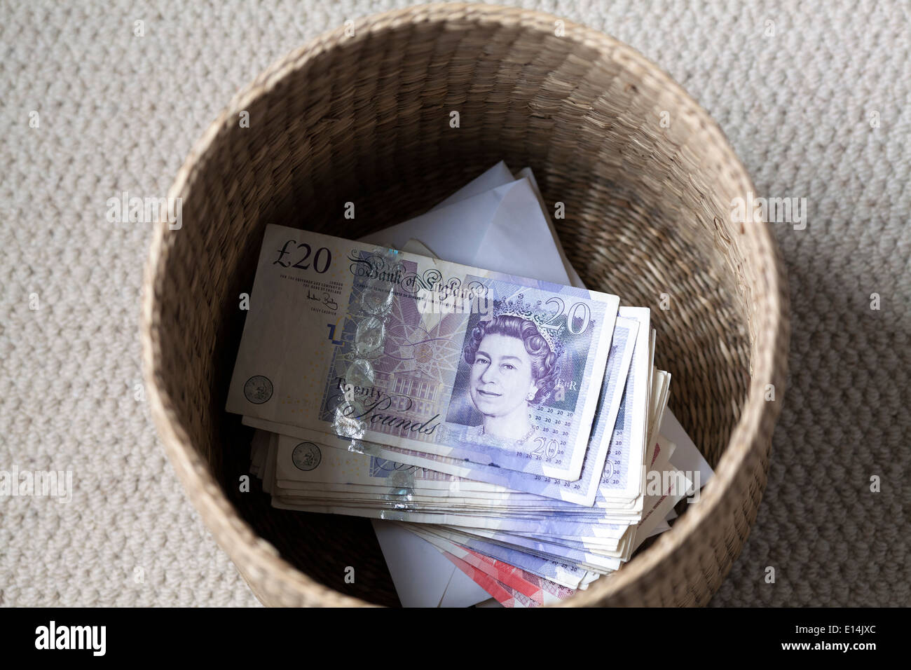Keeping Cash in Woven Basket - UK Stock Photo - Alamy