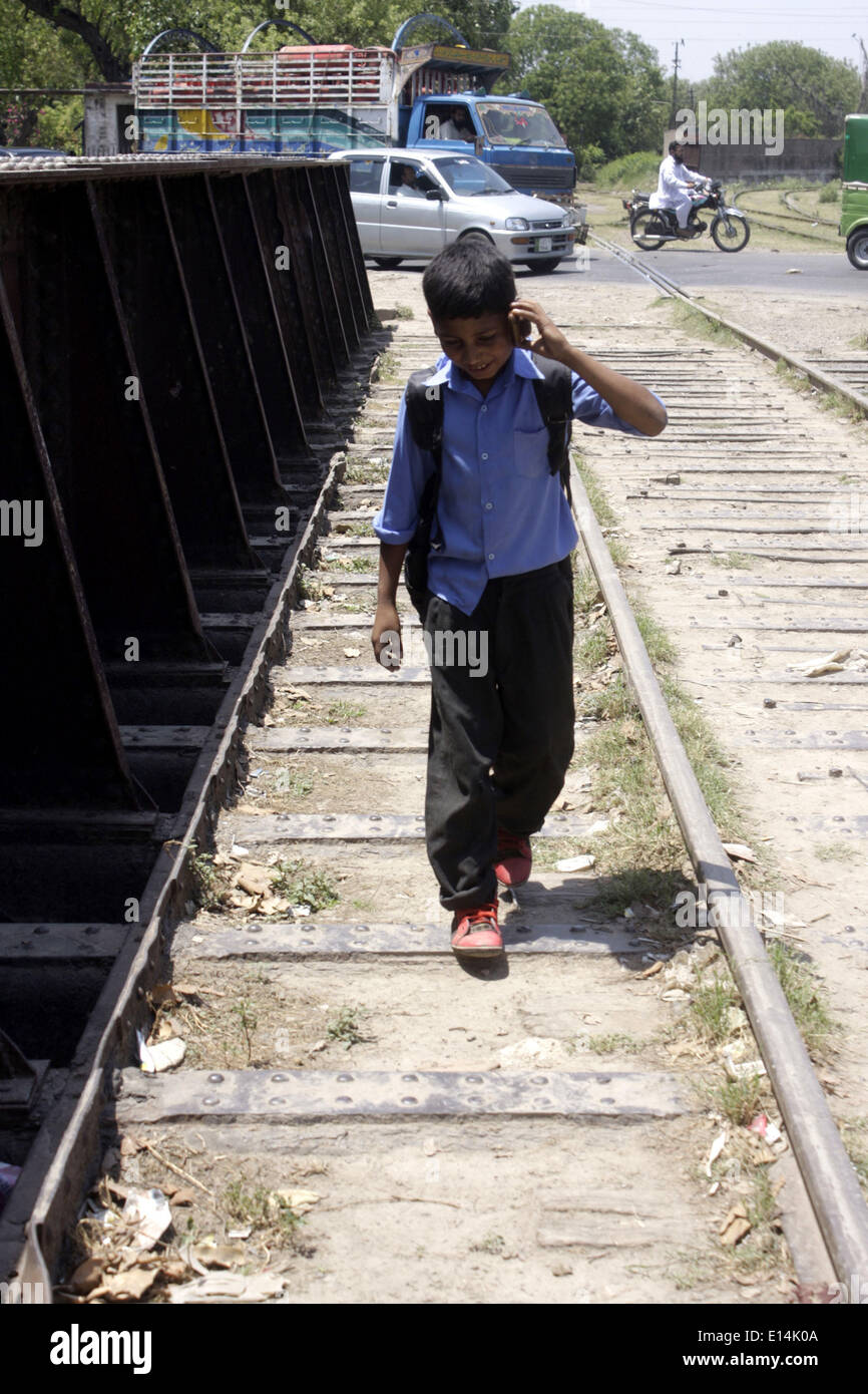 Lahore, Pakistan. 22nd May, 2014. A Pakistani student talks on his ...