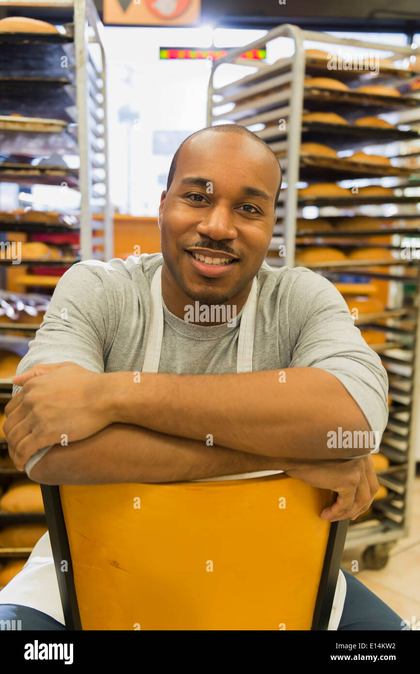 Black baker working in commercial kitchen Stock Photo - Alamy