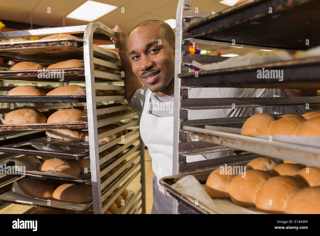 Black baker working in commercial kitchen Stock Photo - Alamy