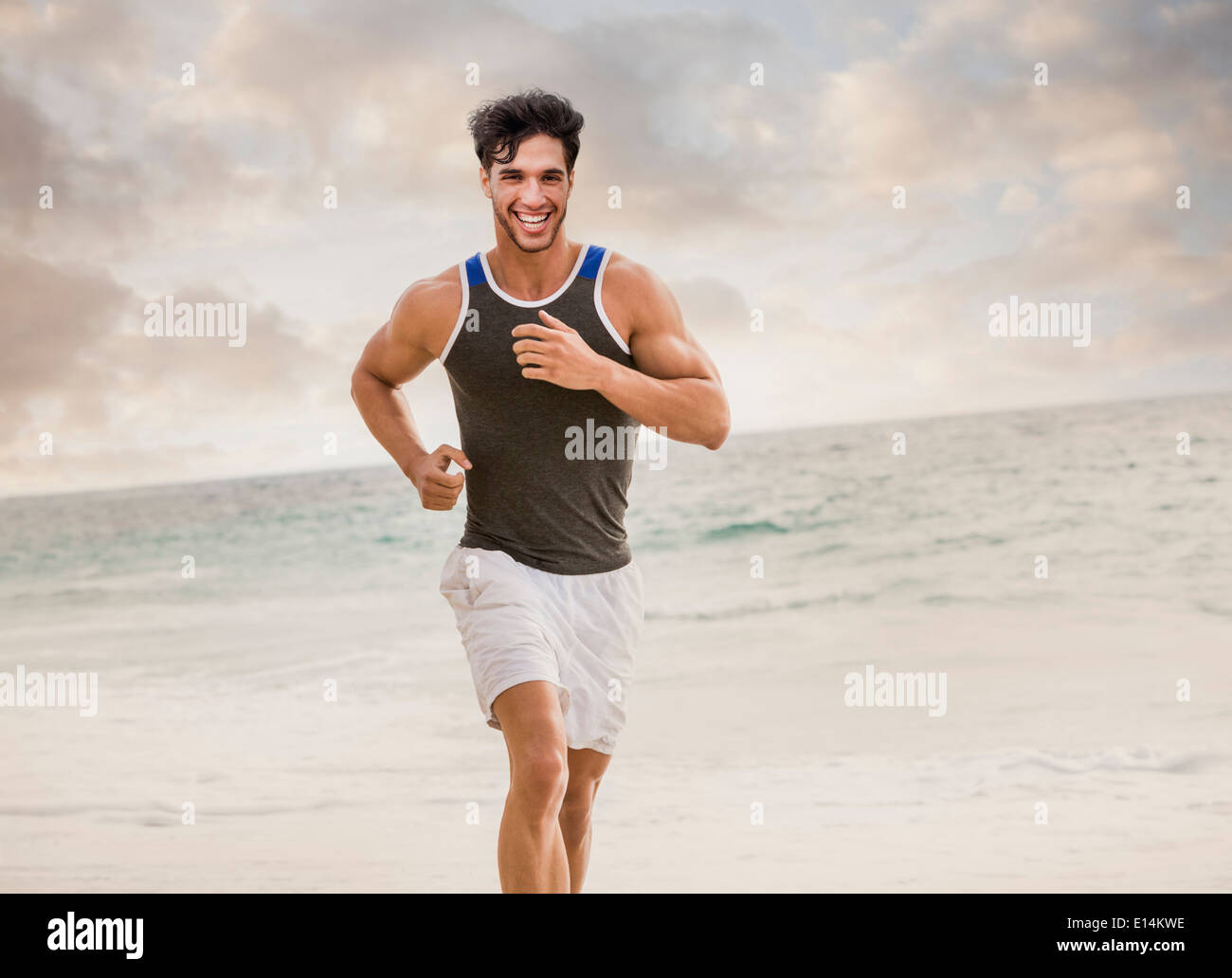 Man running beach hi-res stock photography and images - Alamy