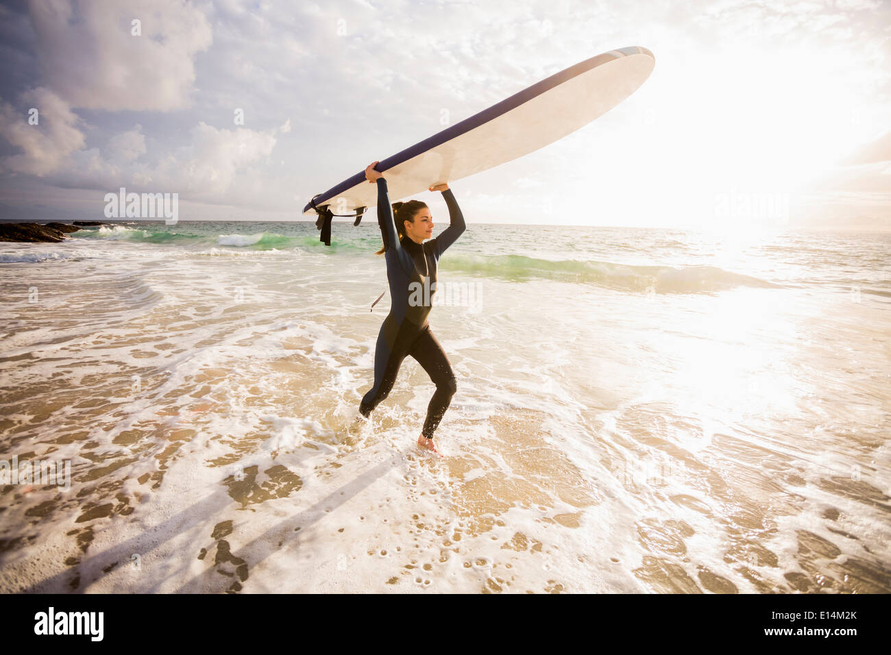 Surfer running with board hi-res stock photography and images - Alamy