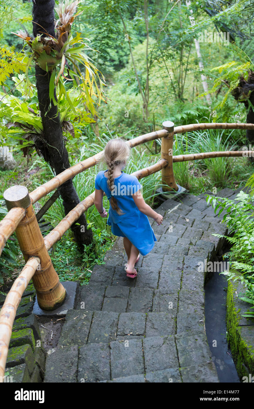 Caucasian girl descending stone steps Stock Photo - Alamy