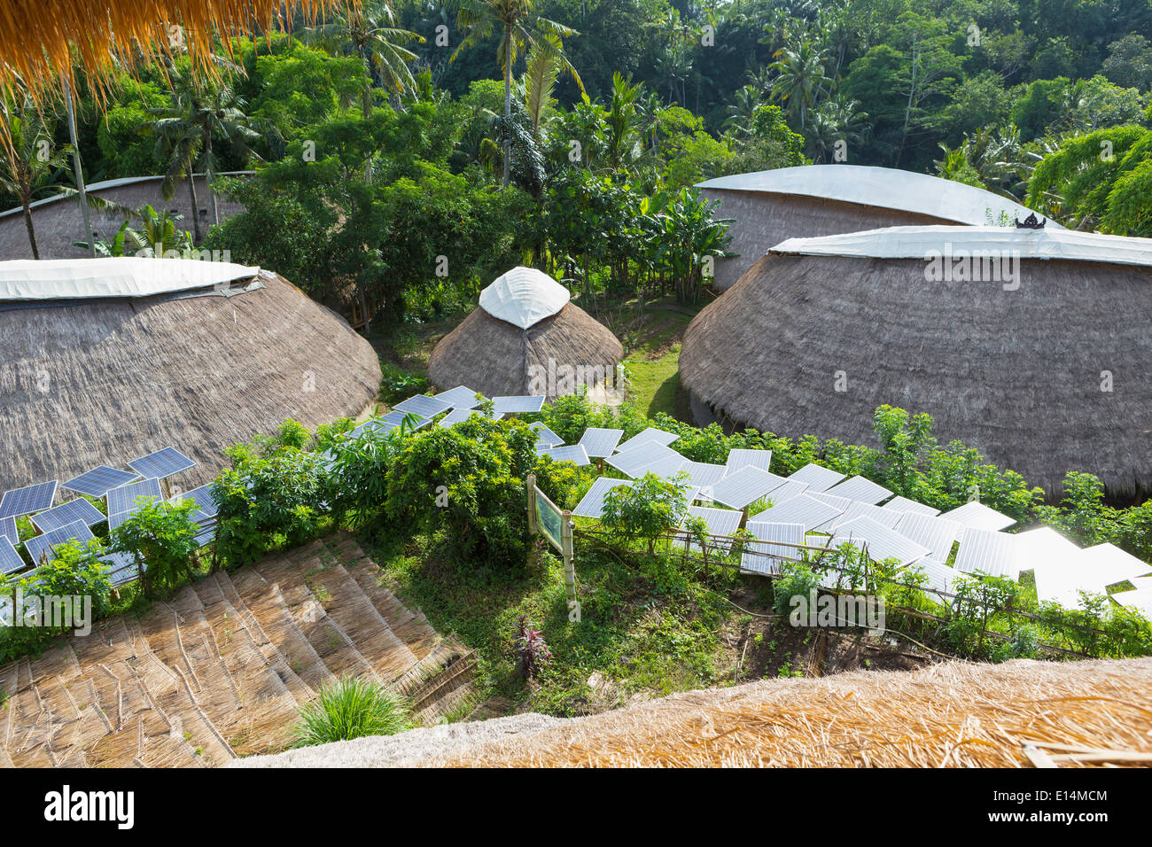 Solar panels among thatched roof buildings Stock Photo - Alamy