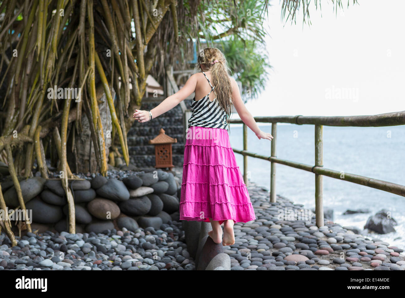 Girl walking along wall hi-res stock photography and images - Alamy