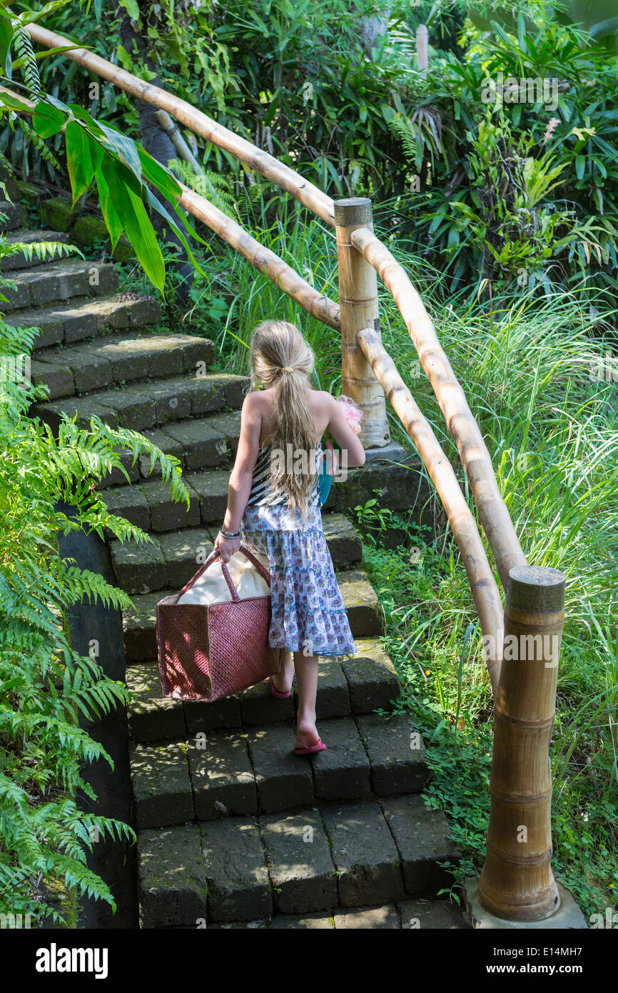 Caucasian girl climbing stone steps Stock Photo - Alamy