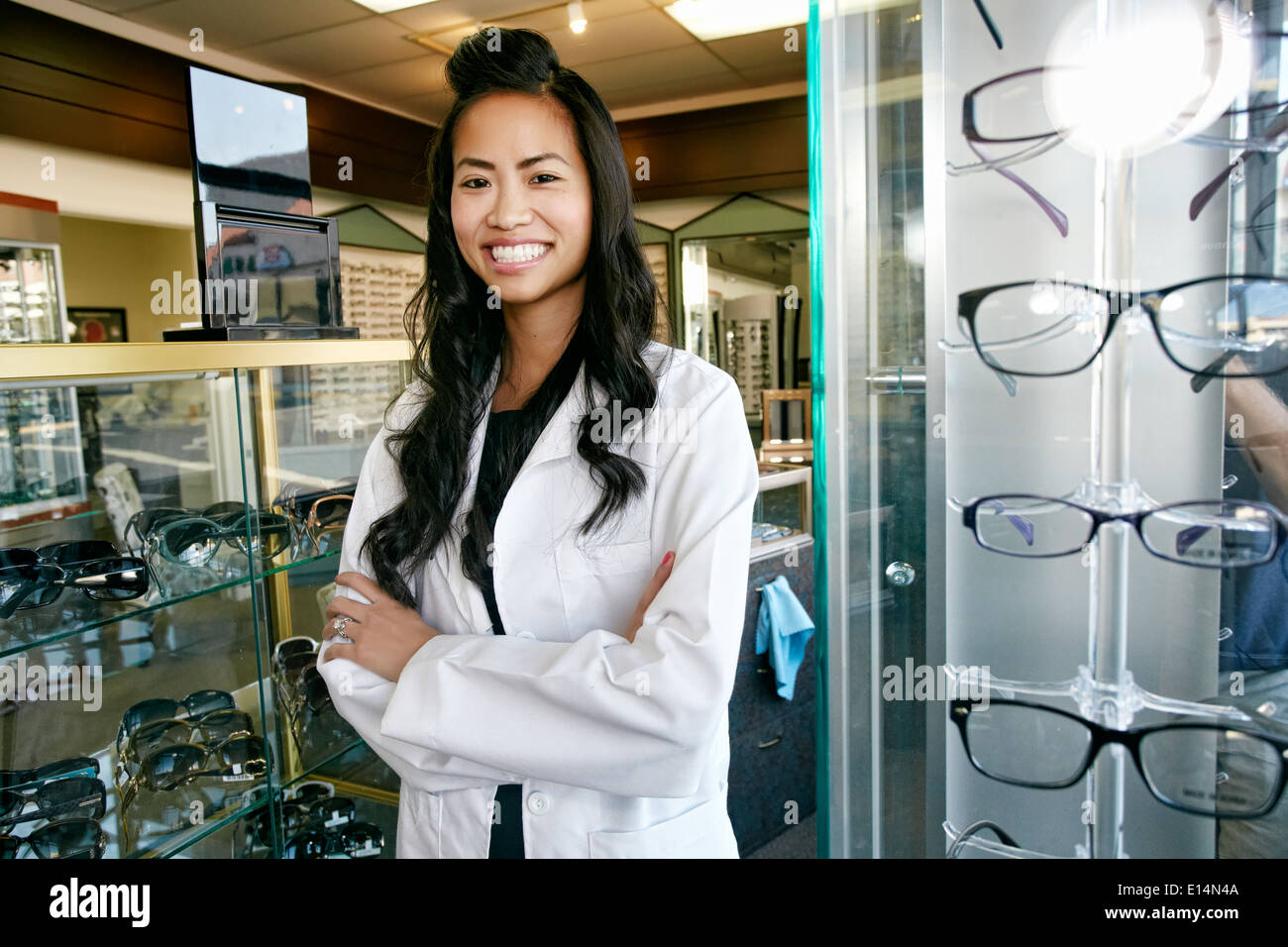 Vietnamese optometrist smiling in office Stock Photo - Alamy