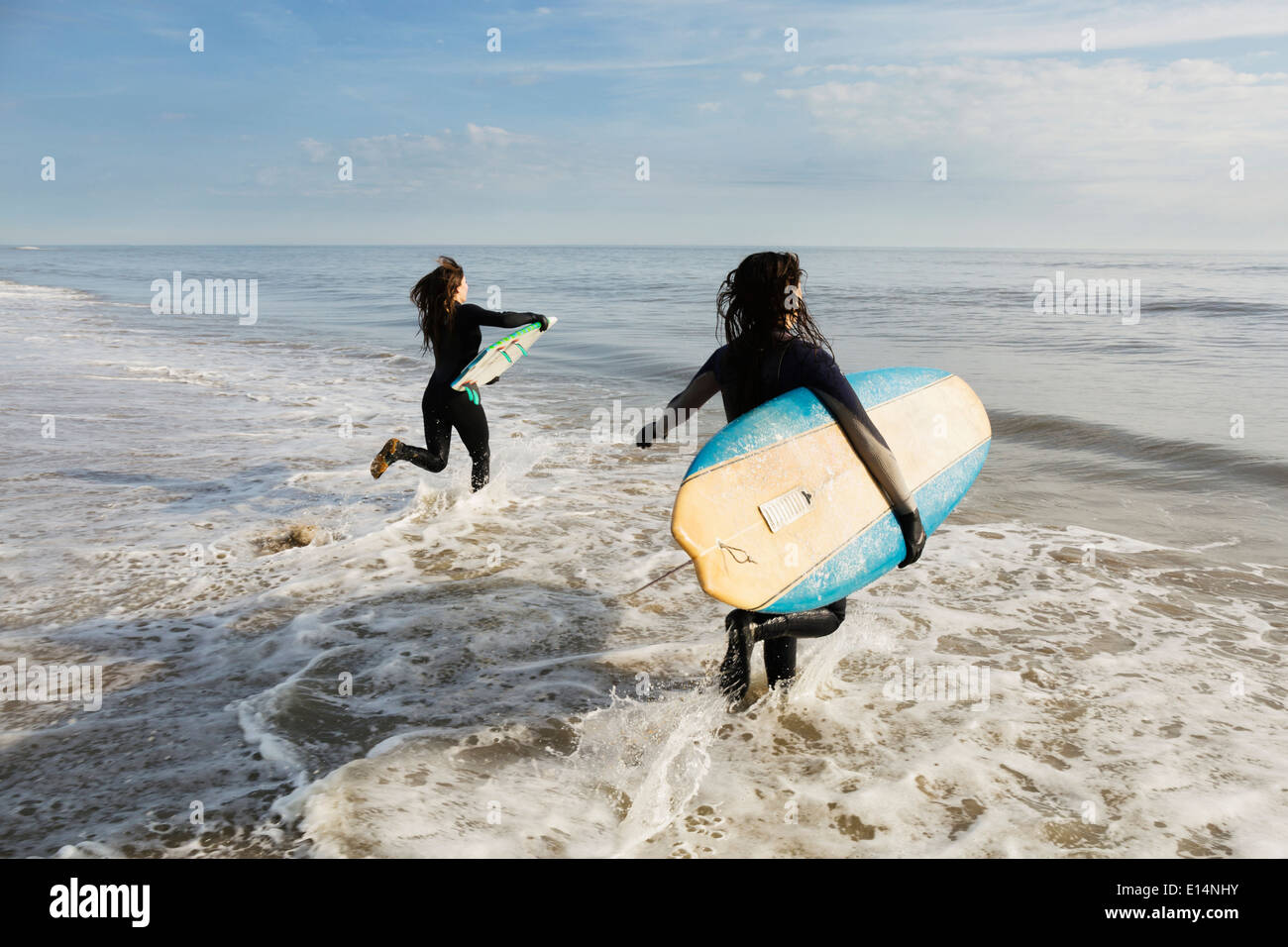 Running carrying surf board surfboard hi-res stock photography and ...