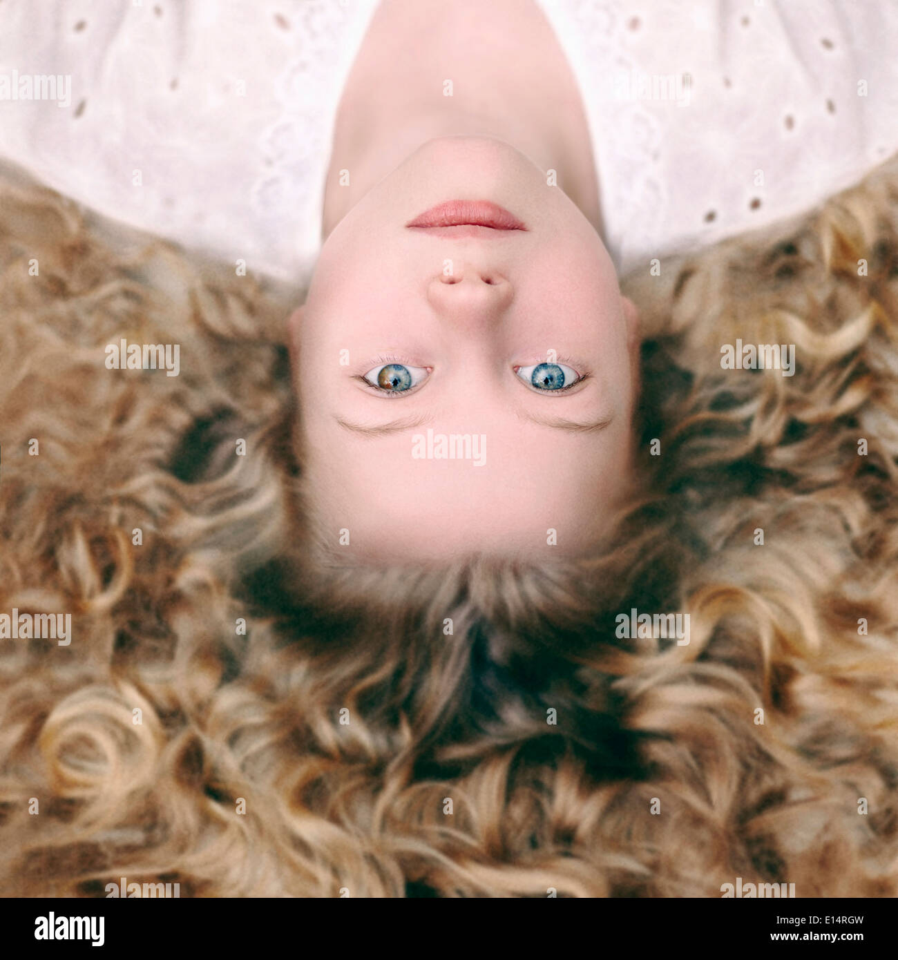 Caucasian girl laying on ground Stock Photo - Alamy