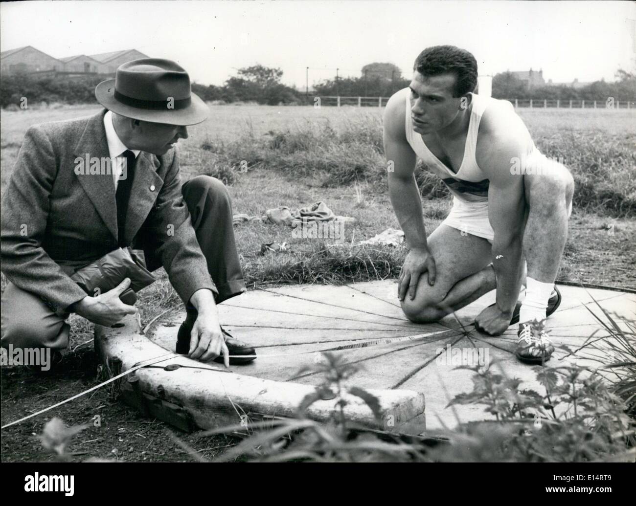 Apr. 18, 2012 - Arthur Rowe checks the distance of his throw with G.M ...