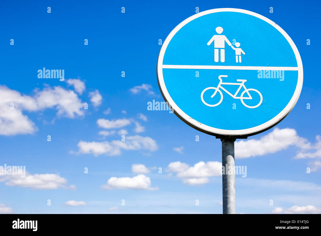 Bicycle and pedestrian shared route sign on the sky background Stock ...