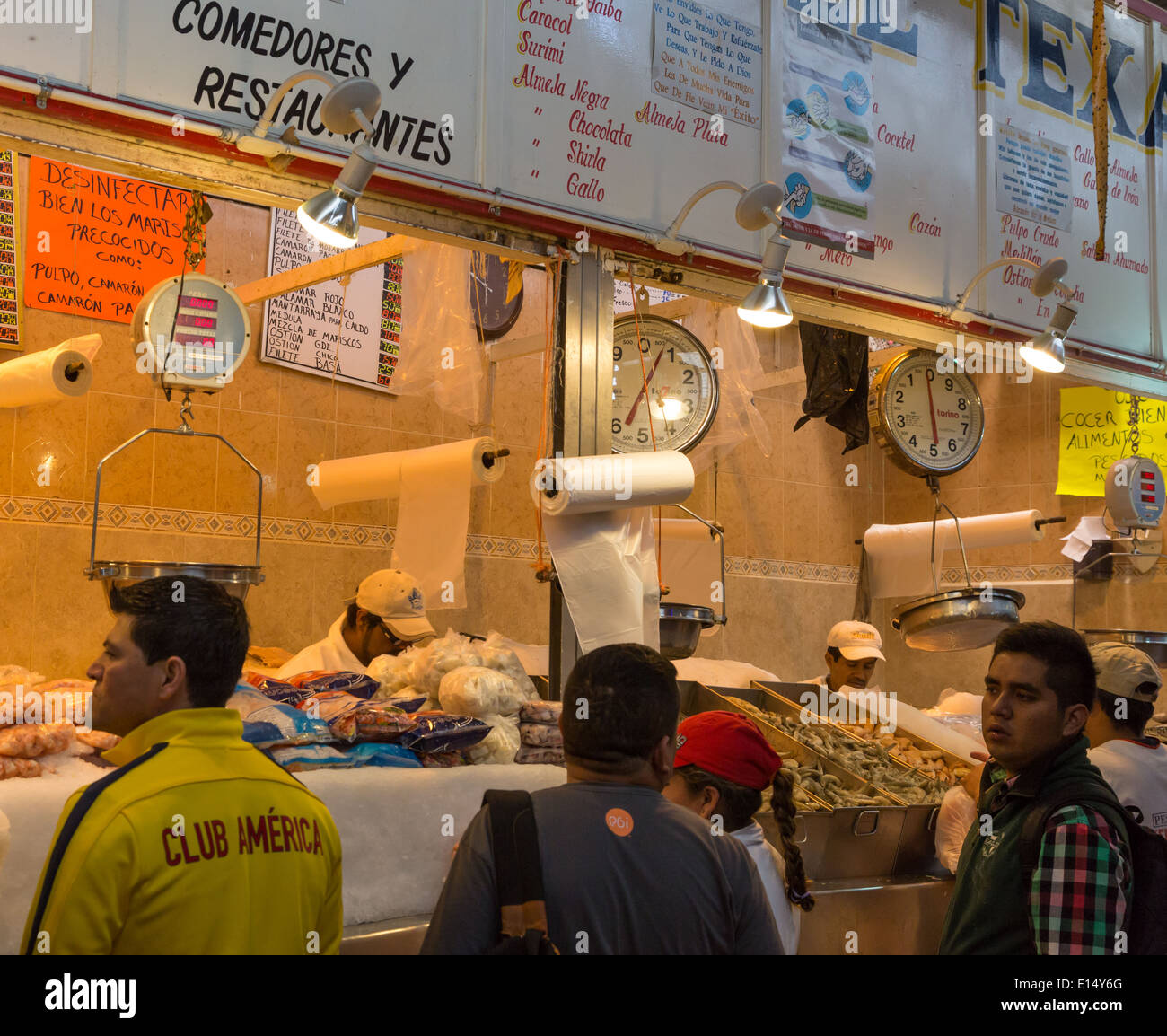 Men shopping at a fish market in the La Cruz mercado in Queretaro ...