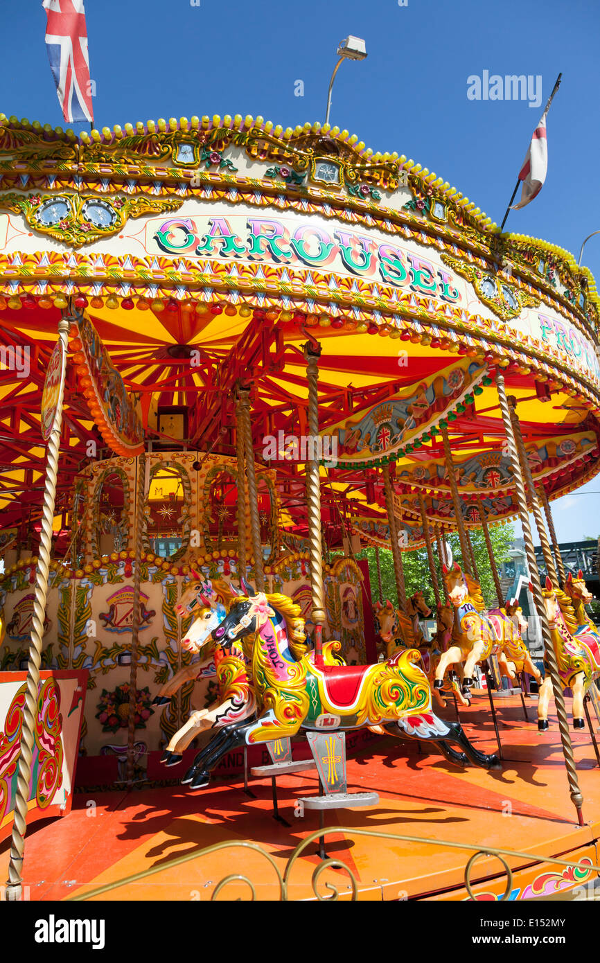 Unoccupied traditional carousel fair ground ride Stock Photo - Alamy