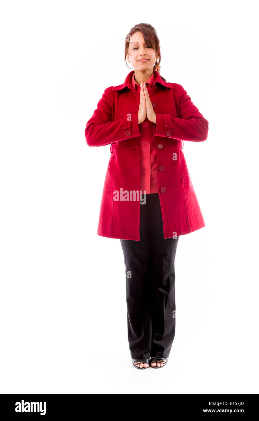 Indian young woman standing in prayer position Stock Photo - Alamy