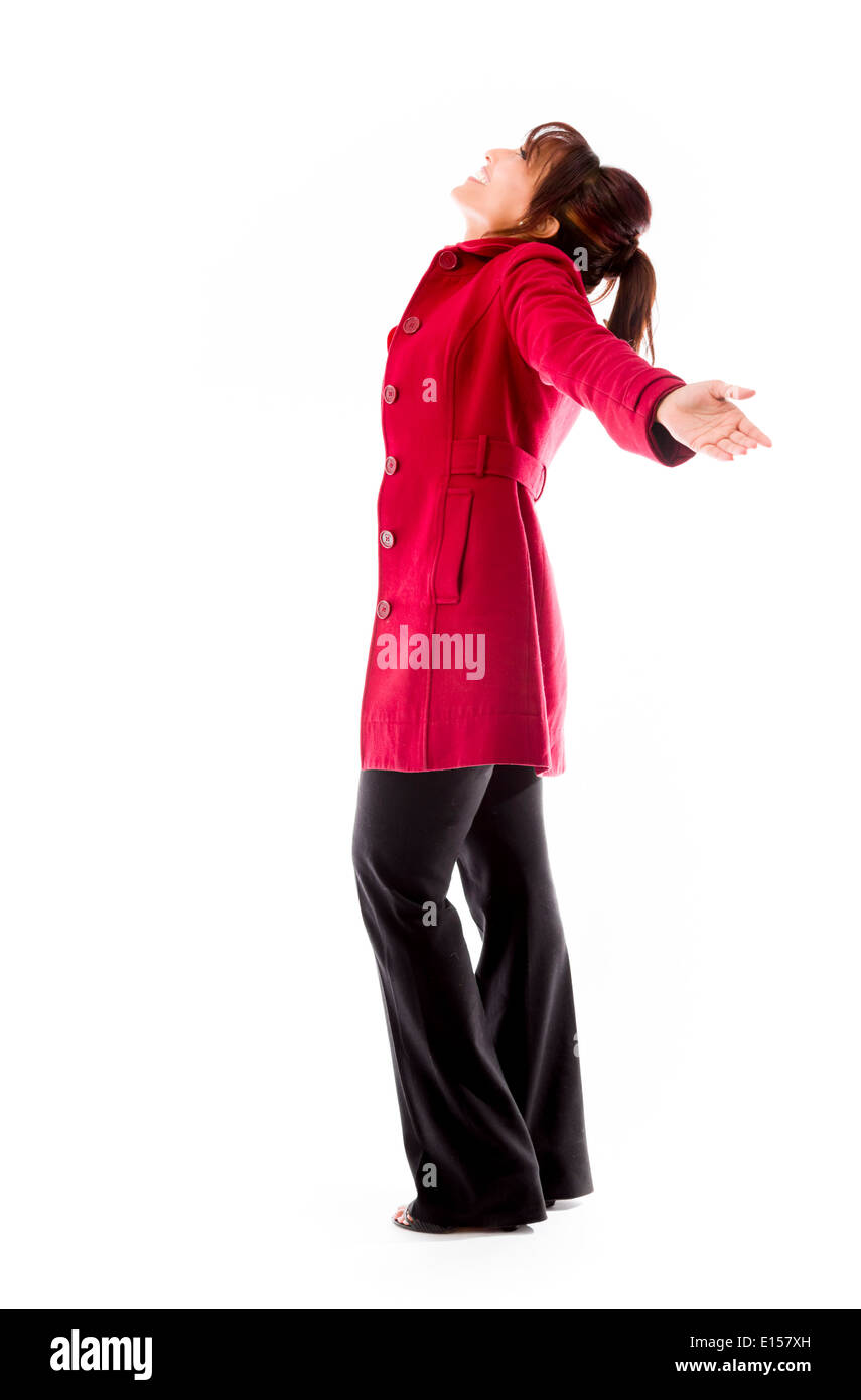 Side profile of an Indian young woman with arms outstretched and day ...