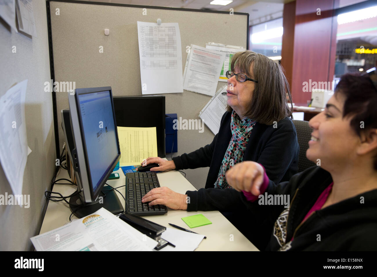 Community volunteer for local nonprofit group signs up client for ...