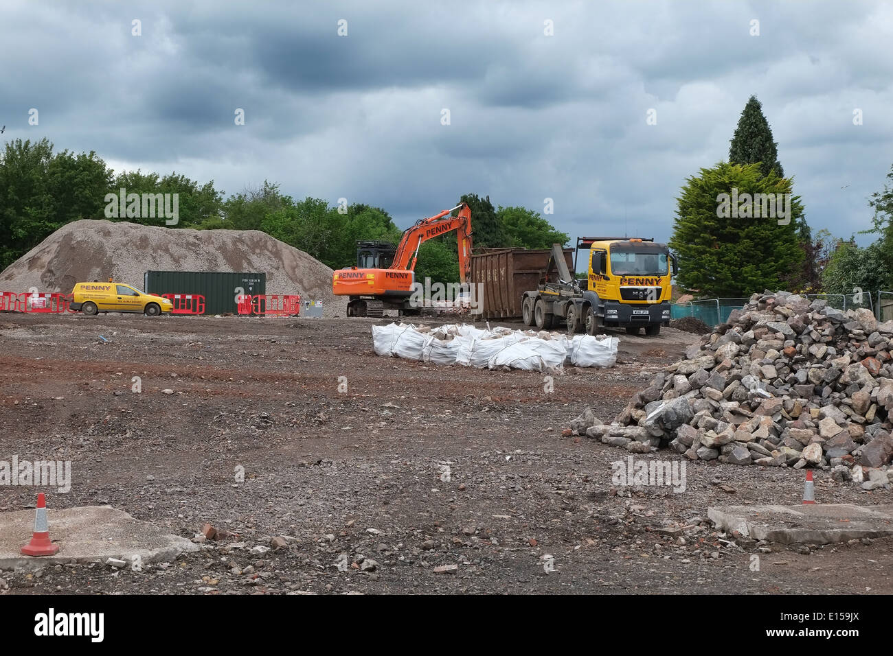 Truck, 360 excavator and stock piles of materials on a demolition in ...