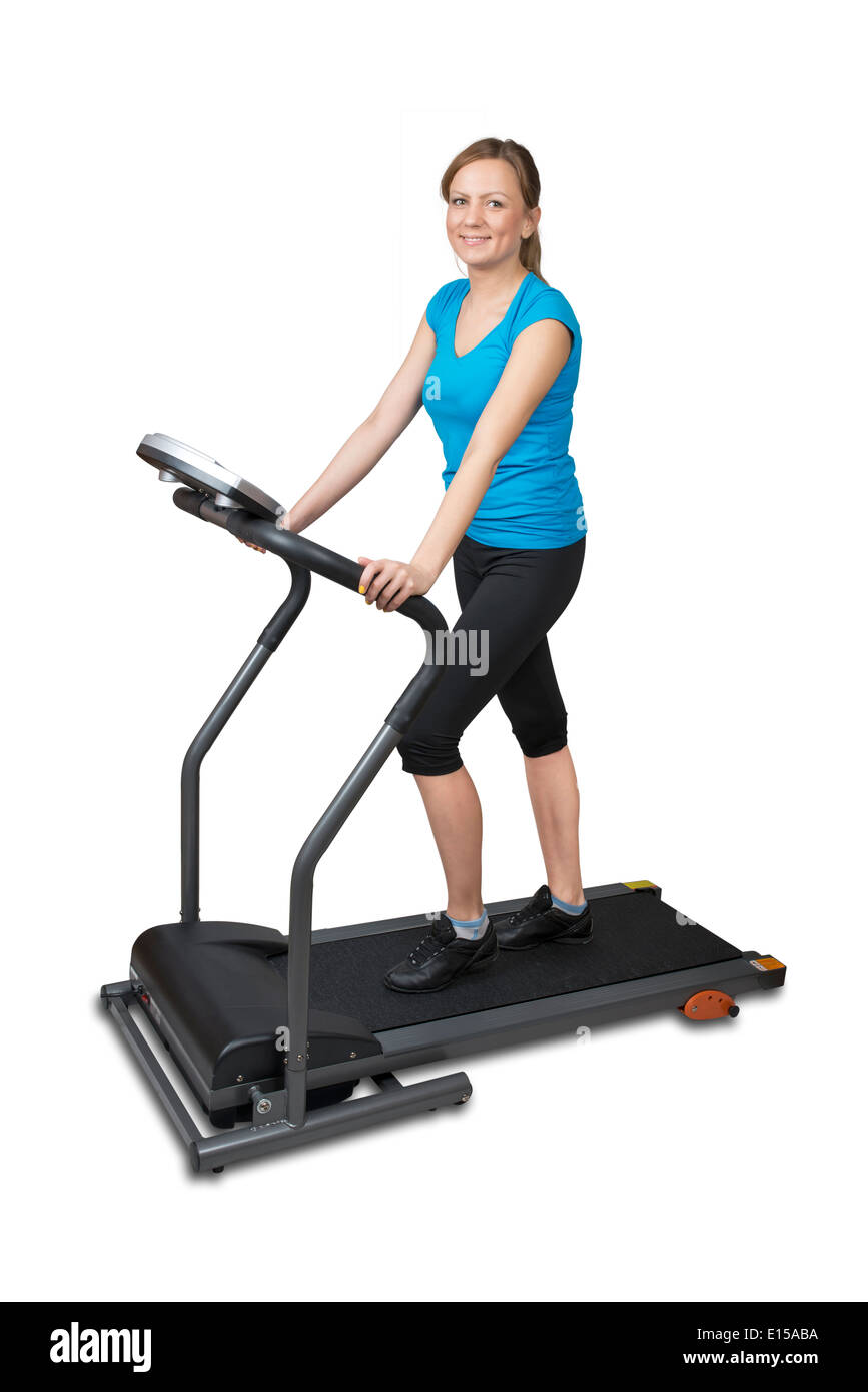 Young woman running on treadmill Stock Photo - Alamy