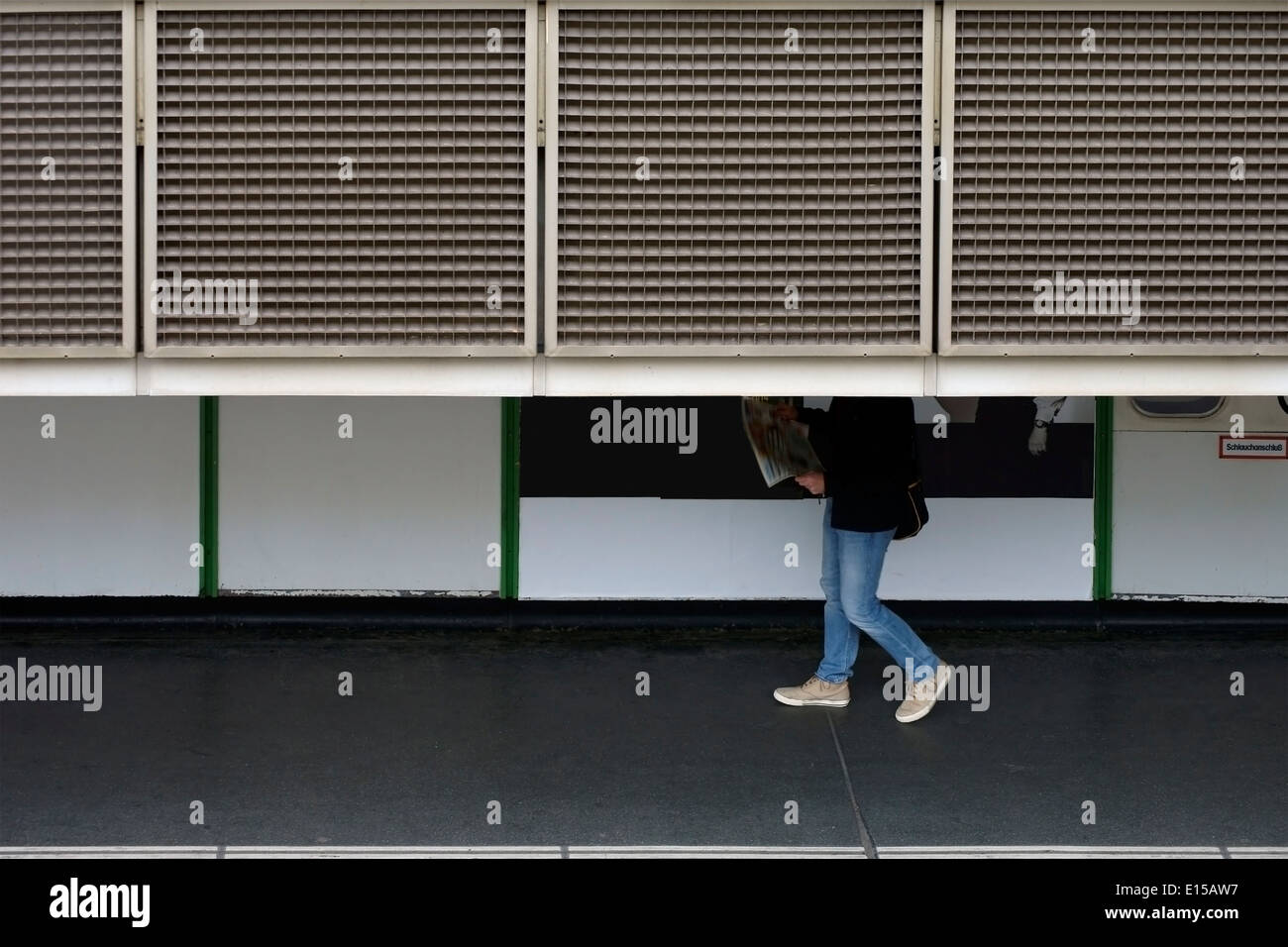 Platform with a waiting person Stock Photo - Alamy
