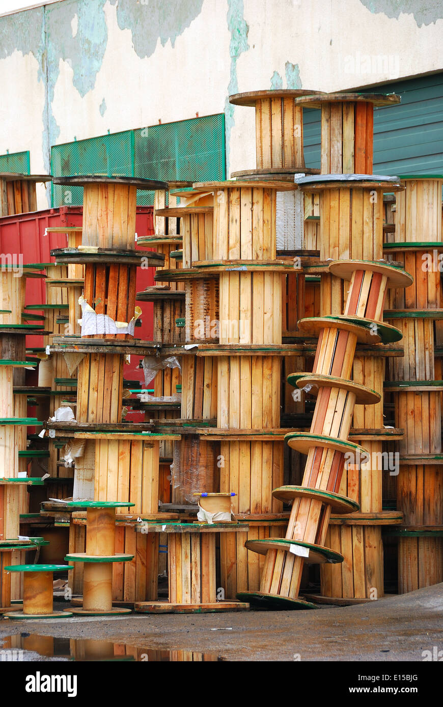 Empty wooden spools outside of a metal wire cable supplier in the ...