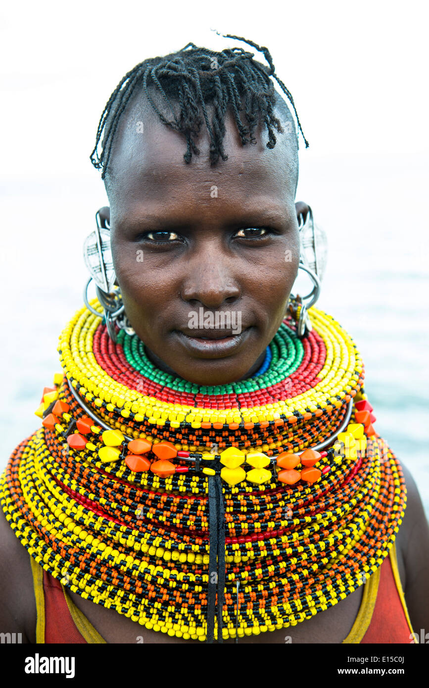 Portrait of a Turkana woman wearing traditional beads and earrings ...