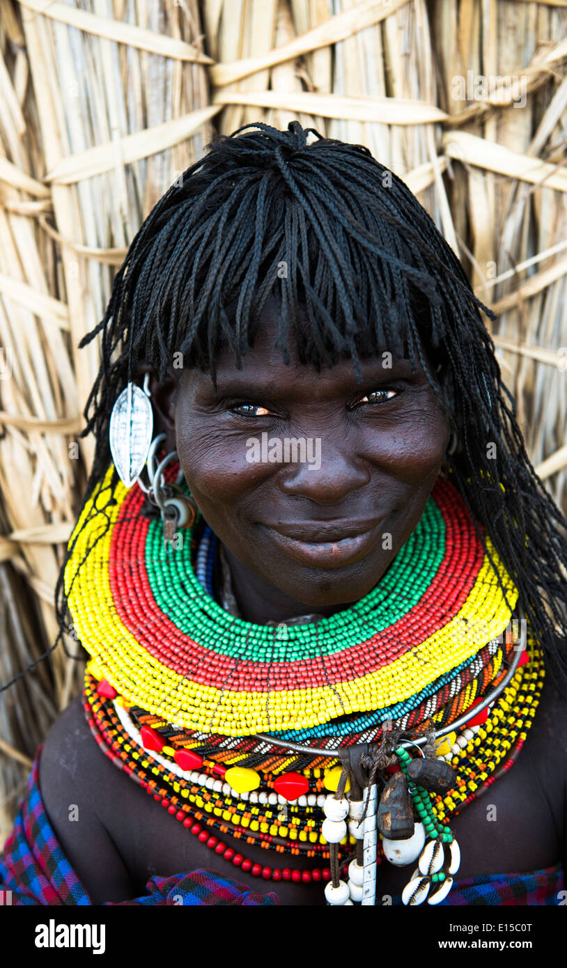 Portrait of a Turkana woman wearing traditional beads and earrings ...