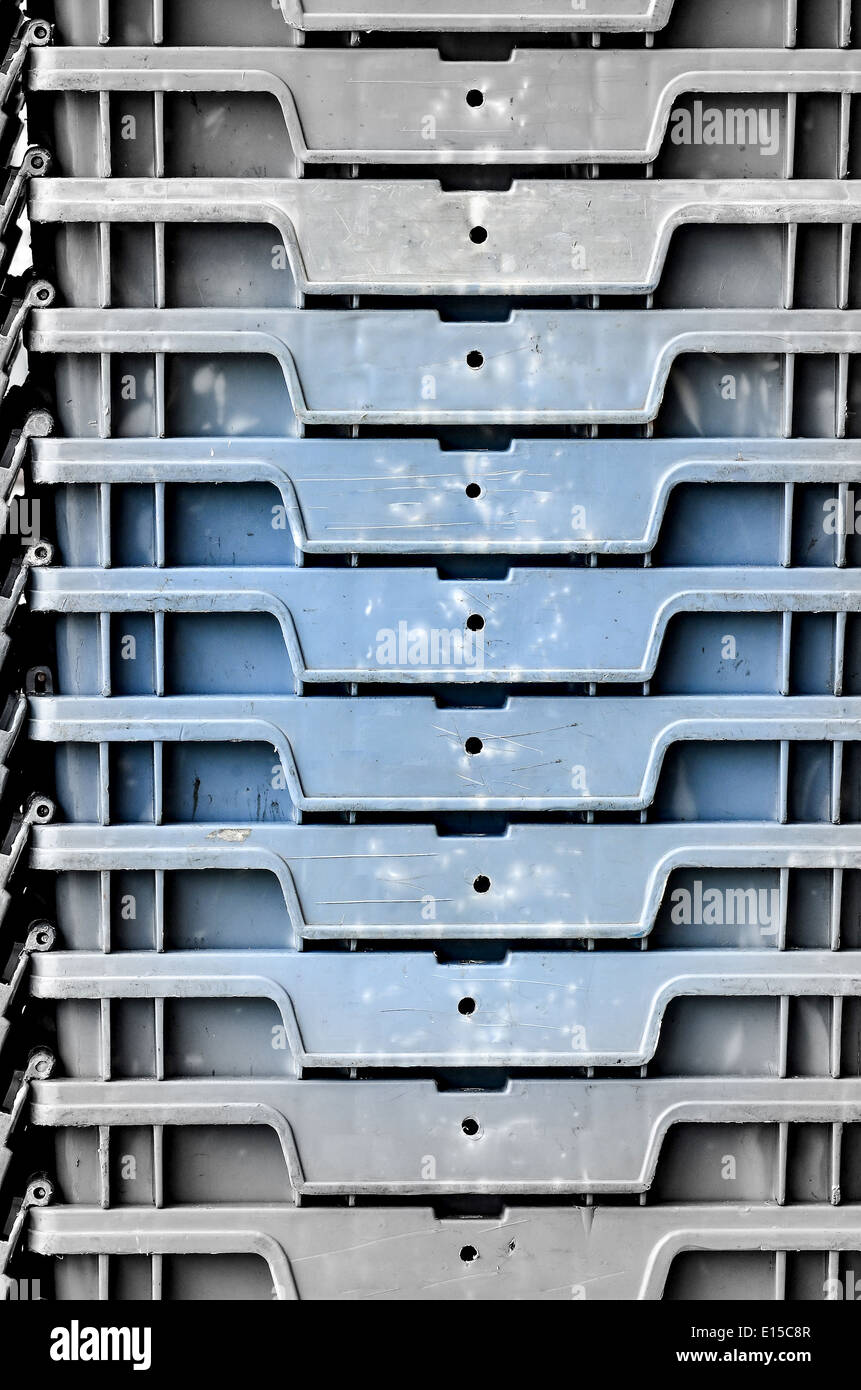 stacks of empty plastic containers with gray light center Stock Photo ...