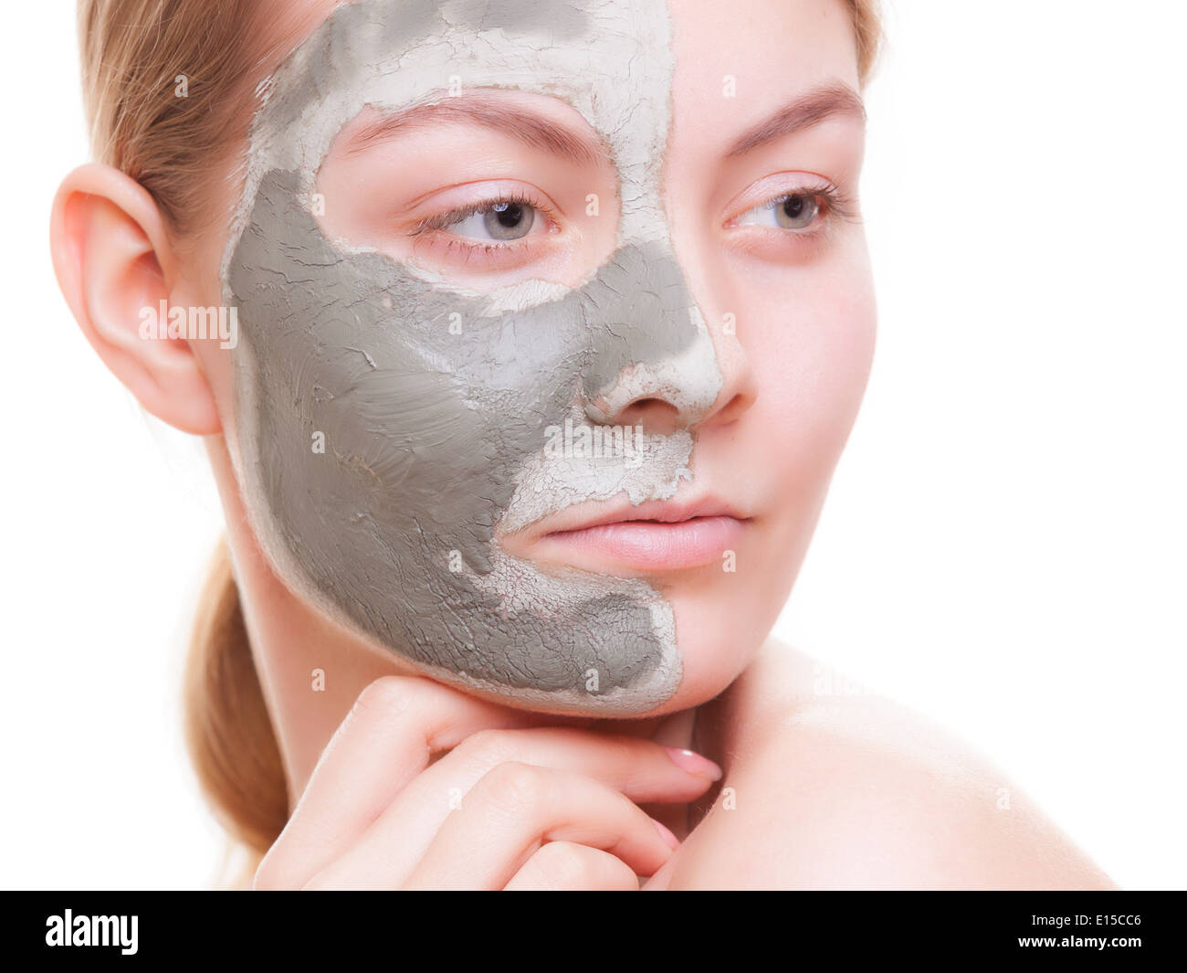 Skin care. Woman applying clay mask on face. Spa Stock Photo - Alamy