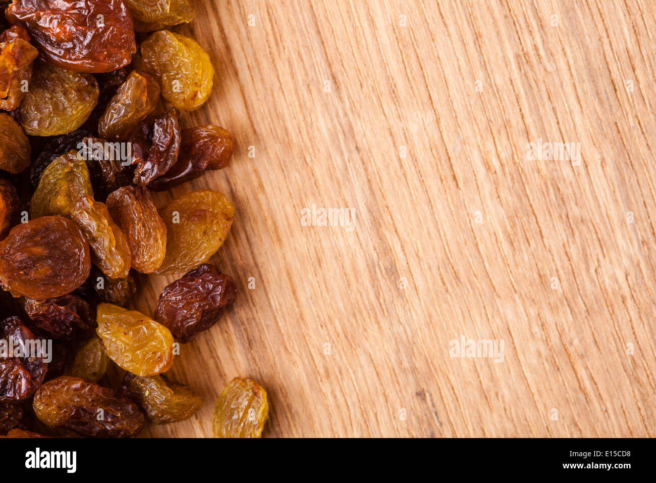 Healthy food organic nutrition. Border frame of raisin on wooden table ...