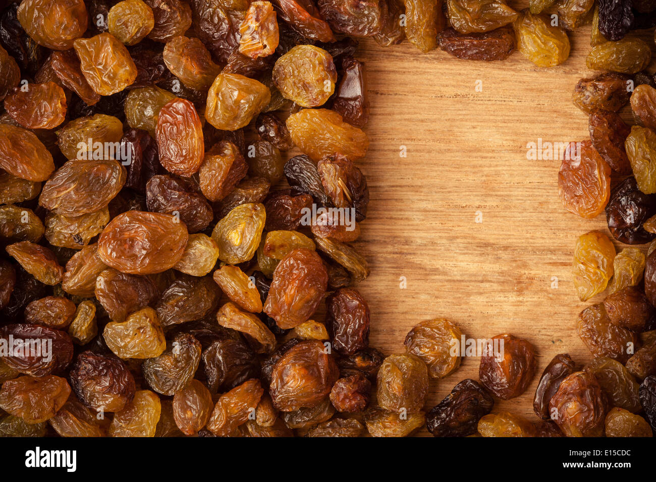 Healthy food organic nutrition. Border frame of raisin on wooden table ...