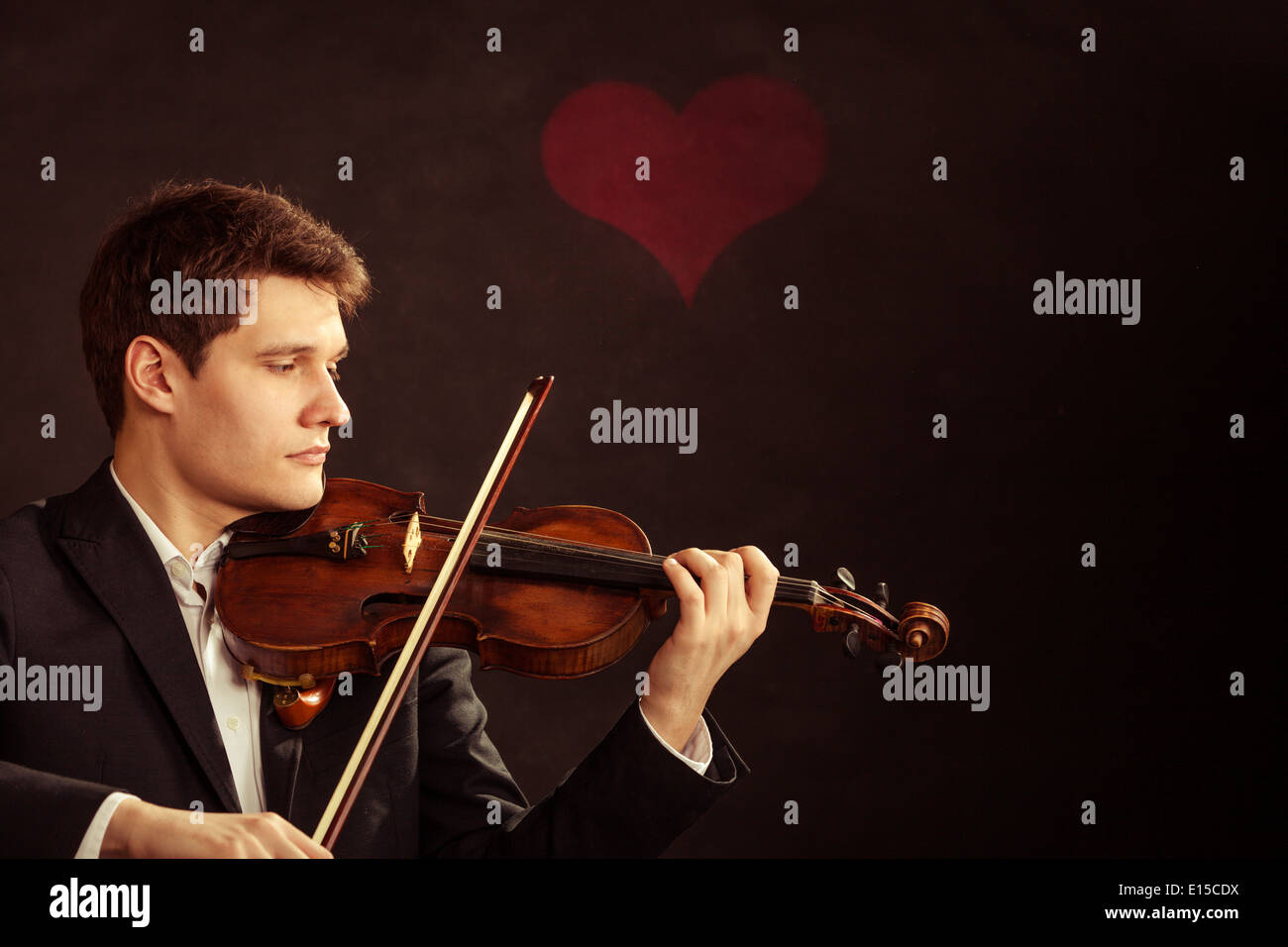 Man violinist playing violin. Classical music art Stock Photo - Alamy