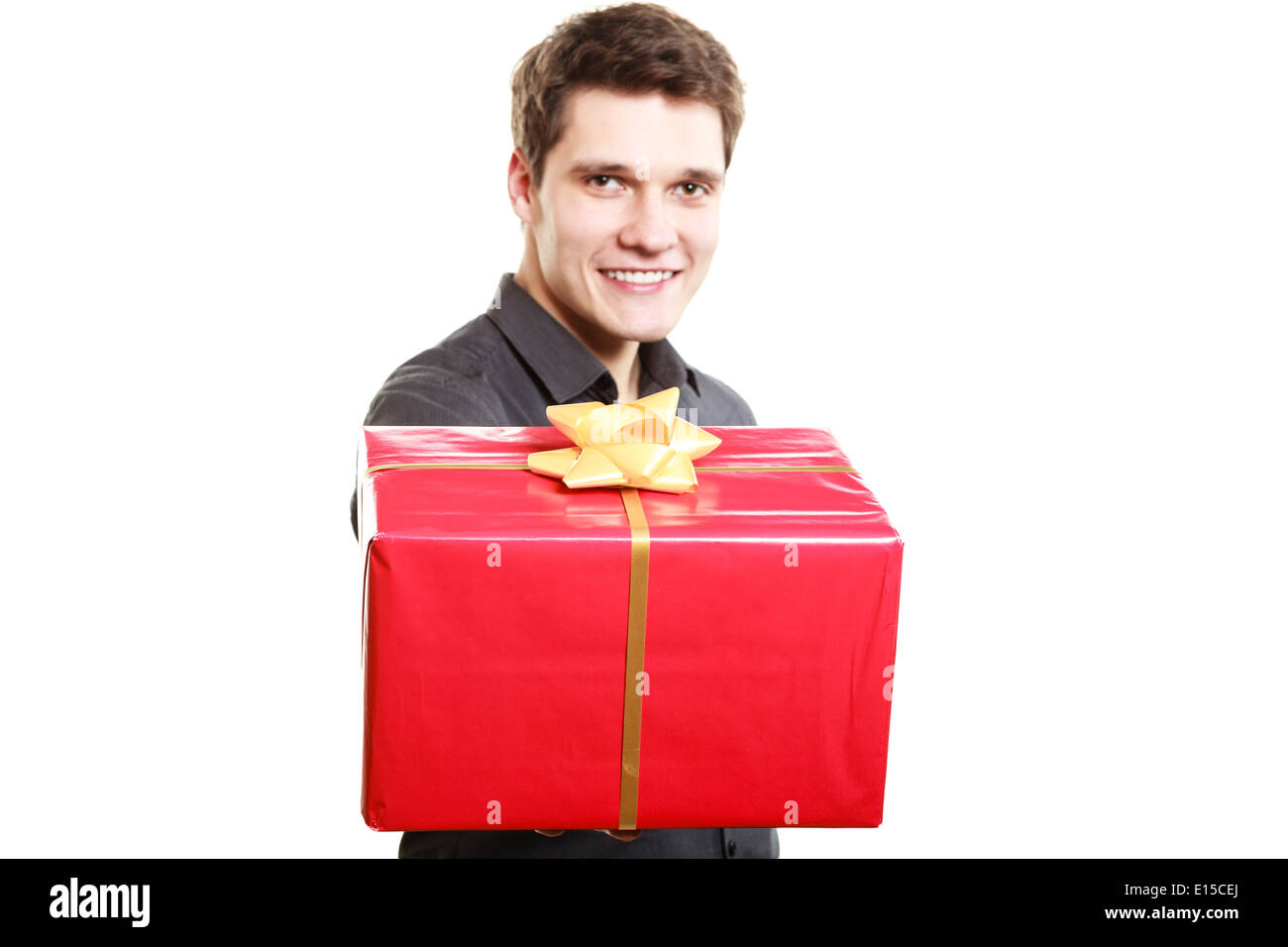 Holiday. Young man giving presents gifts boxes Stock Photo - Alamy