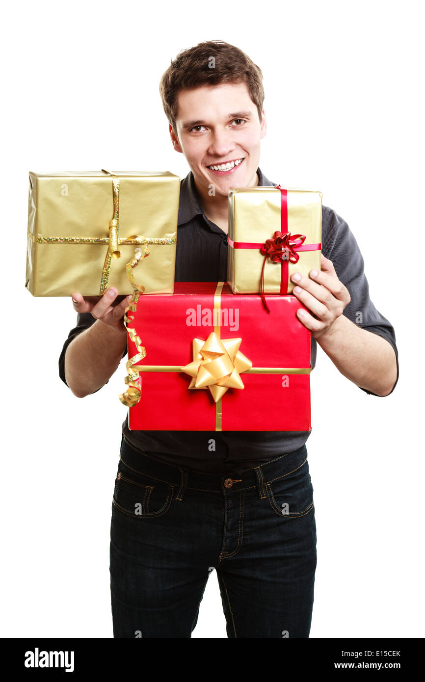Holiday. Young man giving presents gifts boxes Stock Photo - Alamy