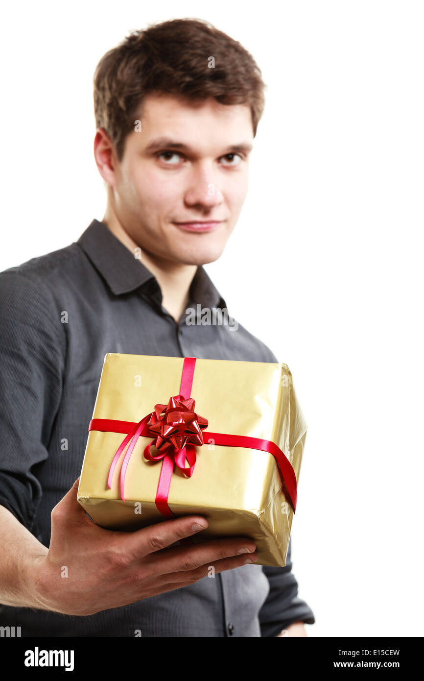 Holiday. Young man giving presents gifts boxes Stock Photo - Alamy