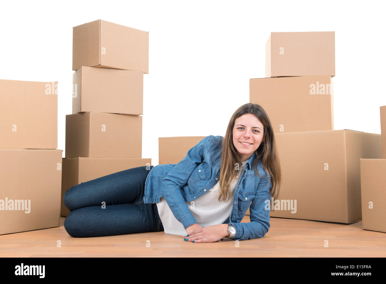 Beautiful girl with cardboard boxes unpacking in new home Stock Photo ...