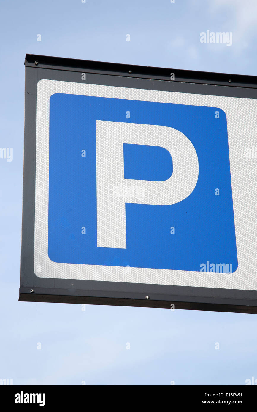 Blue Parking Sign in Urban Setting Stock Photo - Alamy