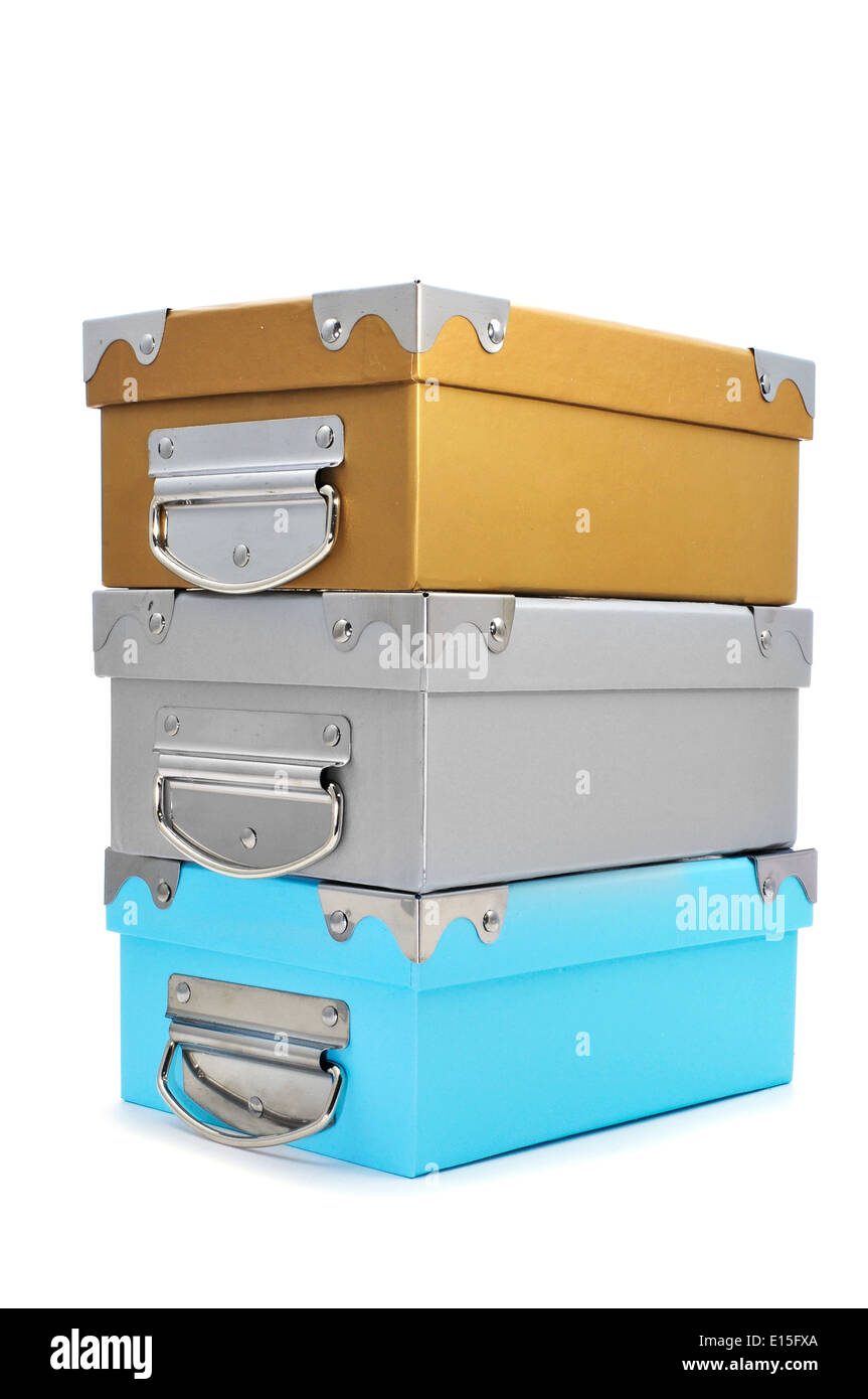 a pile of cardboard storage boxes with different colors and with metal ...