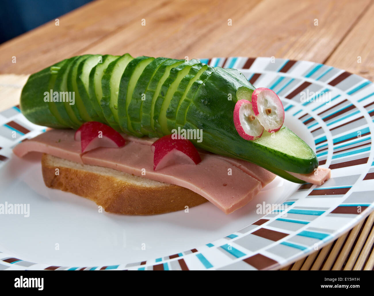 breakfast for child.crocodile sandwich sausage and cucumber Stock Photo ...