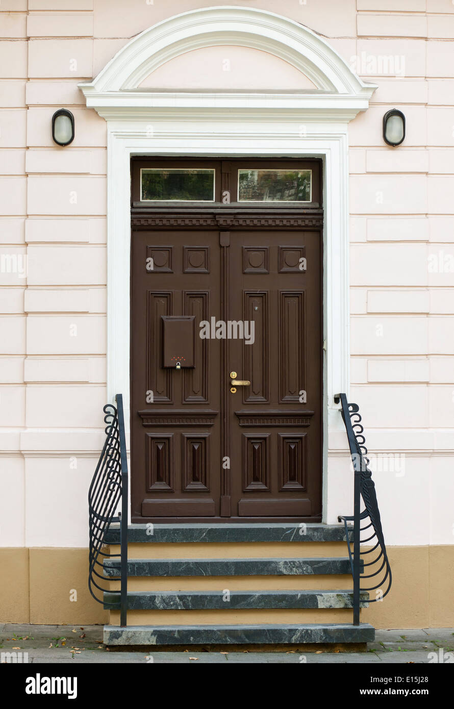 Front door of old house and decorative metal handrail Stock Photo - Alamy