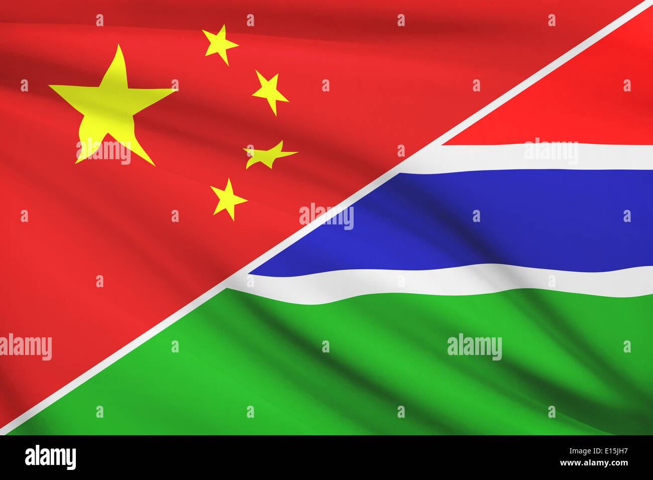 Flags of China and Republic of the Gambia blowing in the wind. Part of ...