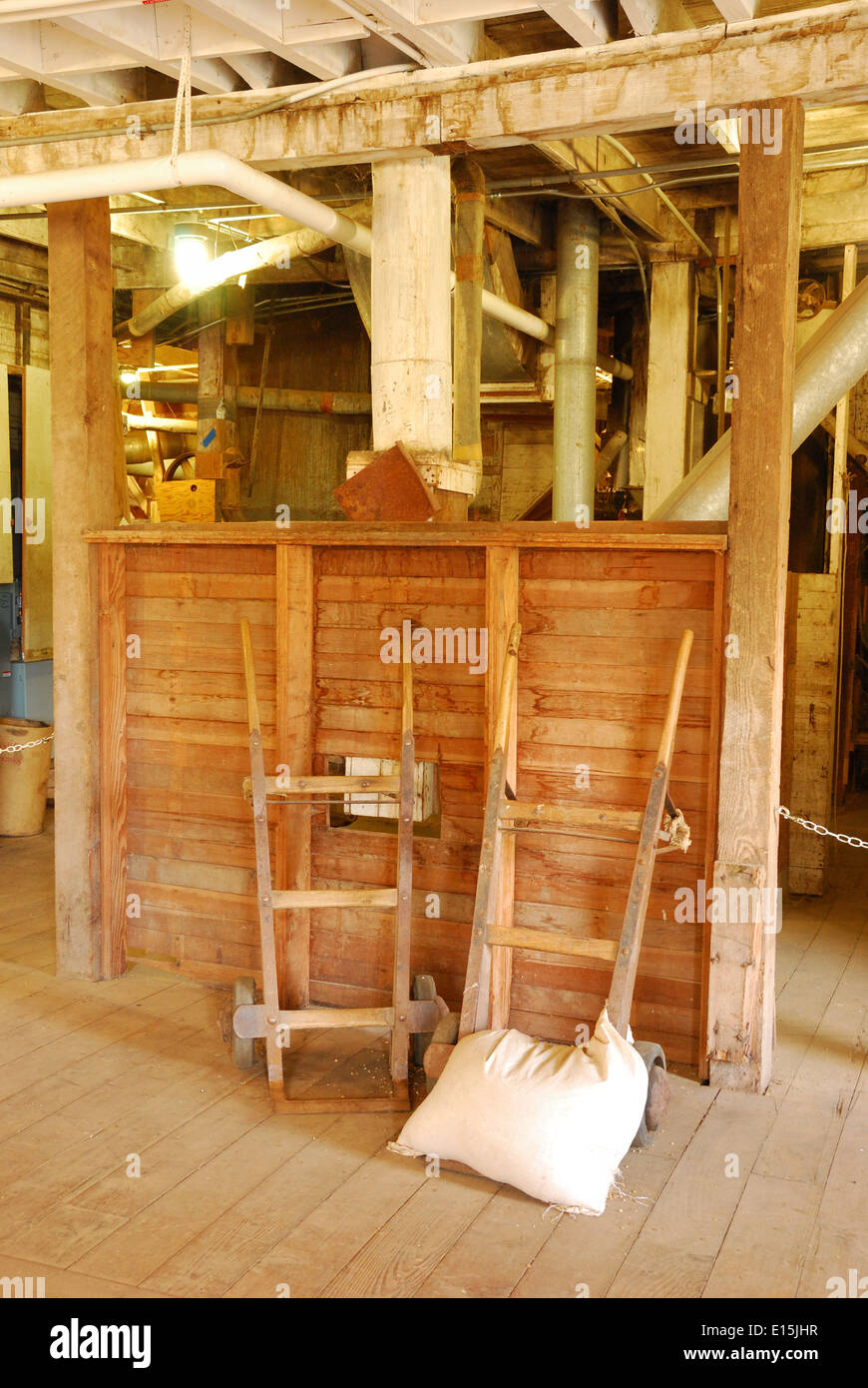 old sack hand cart against a wall in an old agriculture building Stock ...