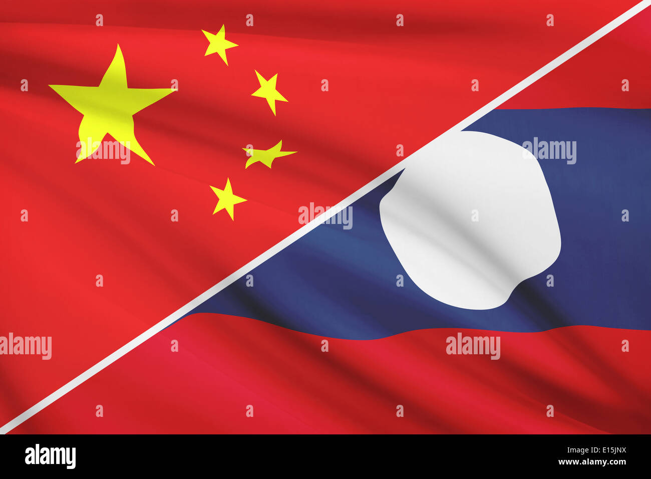 Flags of China and Lao People's Democratic Republic blowing in the wind ...
