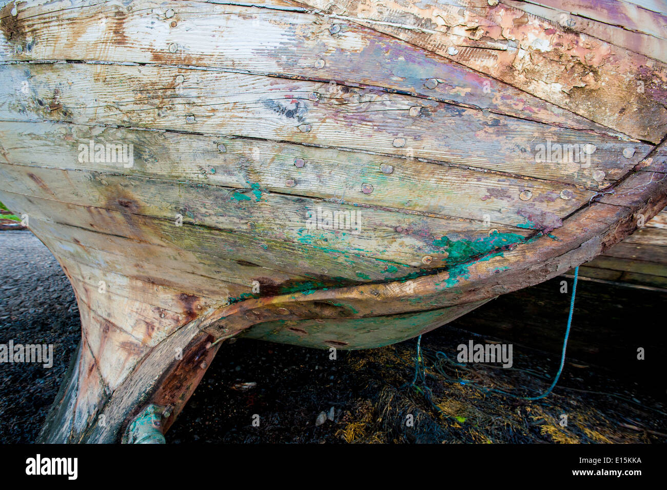 The rotting wooden hull of a fishing boat, beached on its side Stock ...