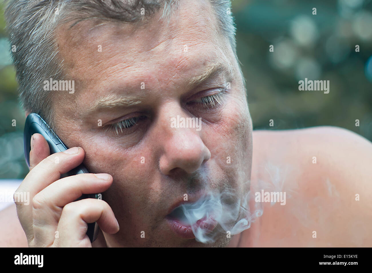 Tired man talk phone hi-res stock photography and images - Alamy