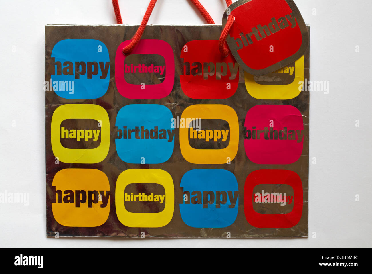 Happy Birthday gift bag with gift tag set on white background Stock ...